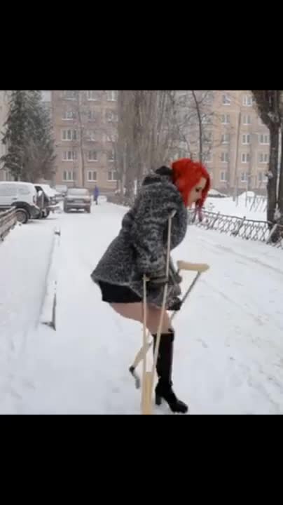 Amputee woman on crutches on icy snow | amputeegirls1 (@amputeegirls1)